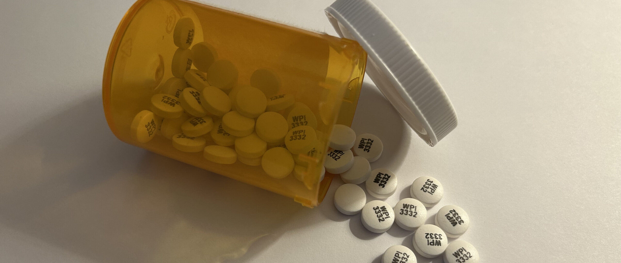 MUN School of Pharmacy holding pill drop - Kicker